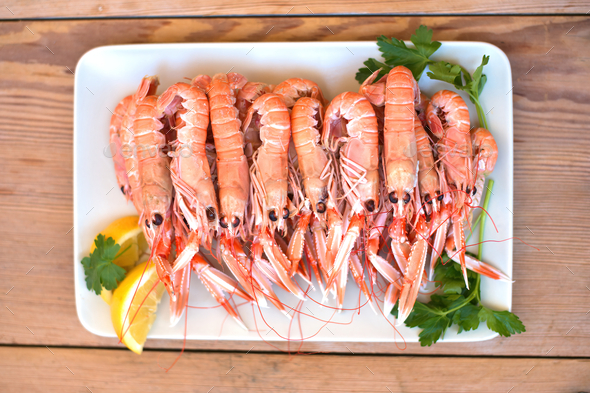 boiled crayfish, with oil and lemon sauce, on a plate, karavides in ...