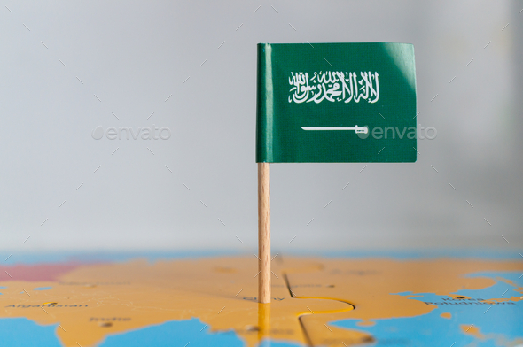 Small flag of Saudi Arabia on a wooden stick fixed on the globe Stock ...