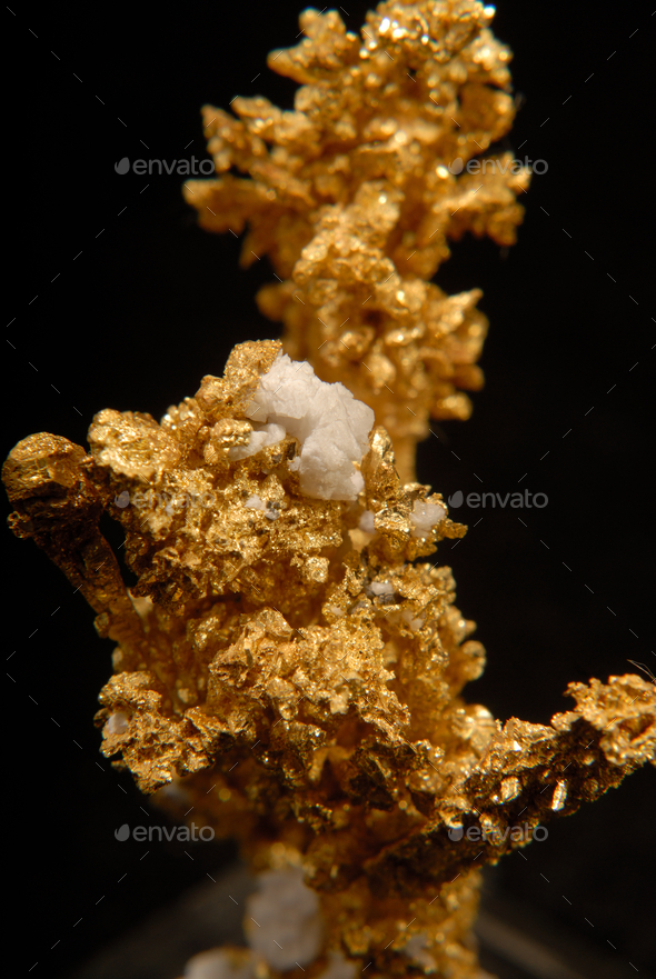 Vertical shot of native gold isolated on a black background Stock Photo ...