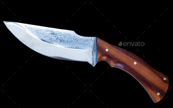 Closeup shot of a sharp hunting knife with a wooden tang isolated on ...