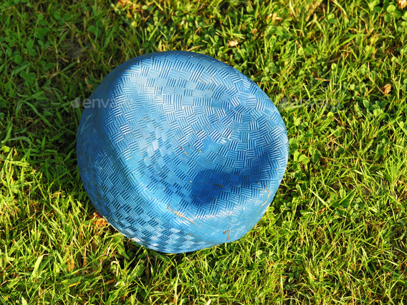 Deflated child's plastic ball, with a depression on its surface Stock ...