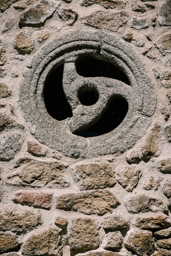 Vertical shot of a round window texture on the stone wall Stock Photo ...