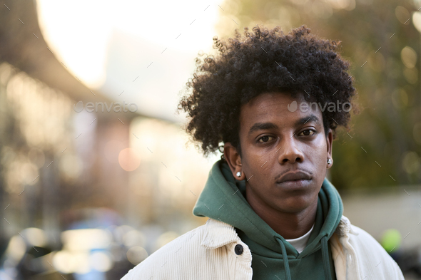 Cool confident young hipster gen z African American teen outdoors ...