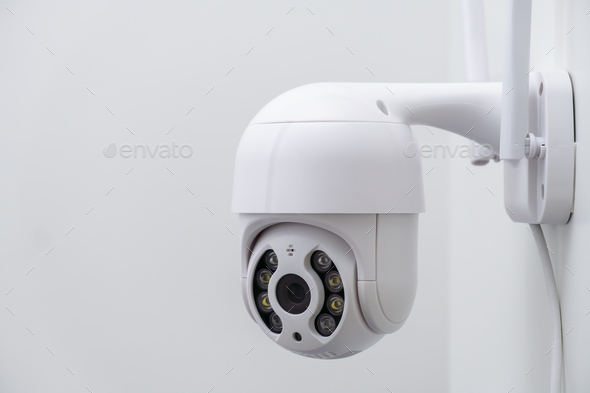 Round CCTV camera with antennas shoots video on the white wall Stock ...
