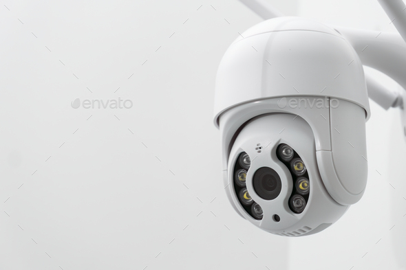 Round CCTV camera with antennas shoots video on the white wall Stock ...