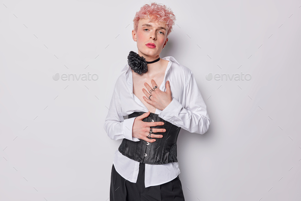 Self confident man transgender with stylish hairstyle wears white shirt ...