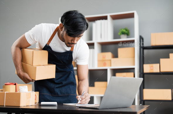 Male online store small business owner entrepreneur seller packing ...