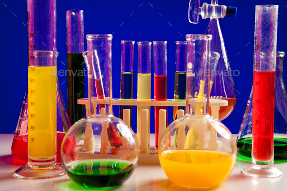 Chemistry equipment set on a table over blue background Stock Photo by ...