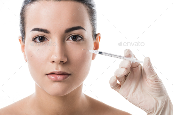 cropped image of beautician making beauty injection to girl with clean ...