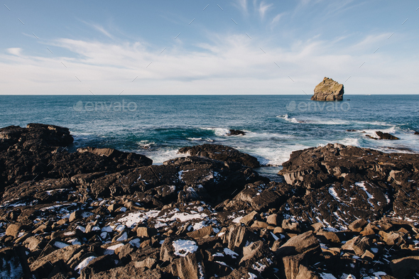 majestic view of icelandic seashore with rocks and snow, reykjanes ...