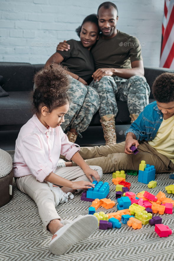 Army soldiers with happy kids playing with constructor Stock Photo by ...