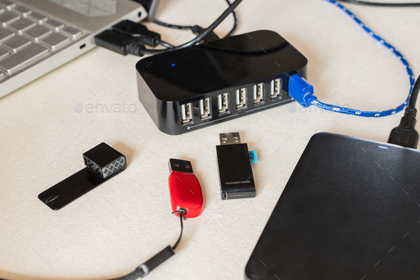 Selective focus closeup of flash drives, and multiple USB ports on the ...