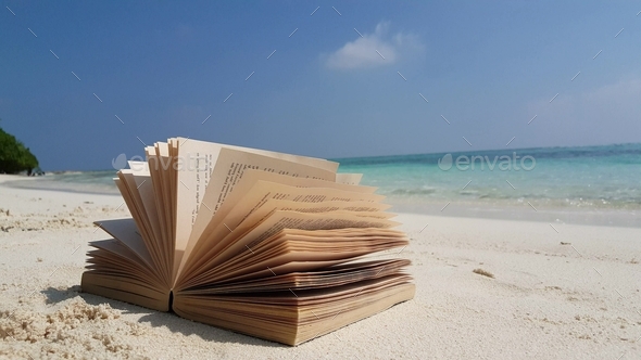 Open book on the beach Stock Photo by wirestock | PhotoDune