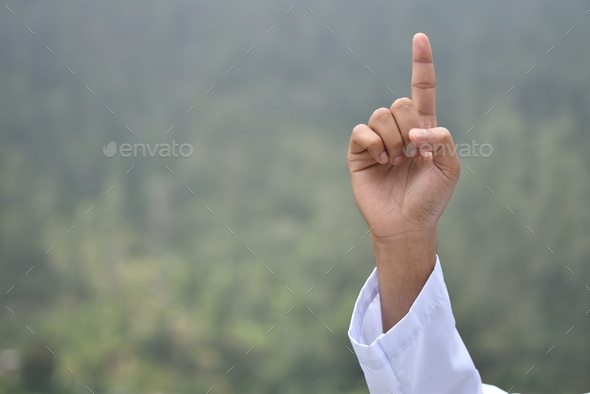 a man's hand with a tawhid symbol Stock Photo by wirestock | PhotoDune
