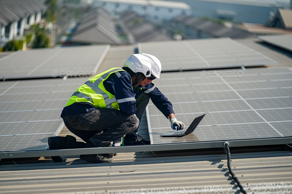 Engineer service check installation solar cell on the roof of factory ...