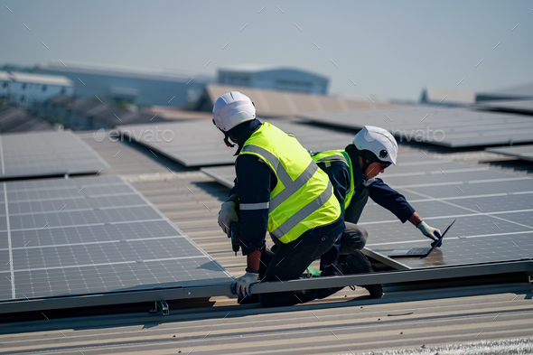 Engineer service check installation solar cell on the roof of factory ...