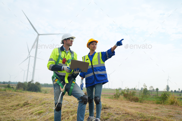 Wind turbine maintenance engineer at wind farm construction site. Stock ...