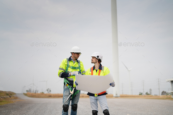 Wind turbine maintenance engineer at wind farm construction site. Wind ...