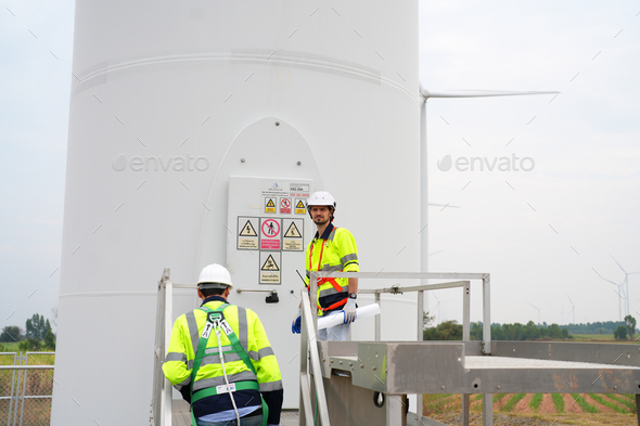 Wind turbine maintenance engineer at wind farm construction site. Wind ...