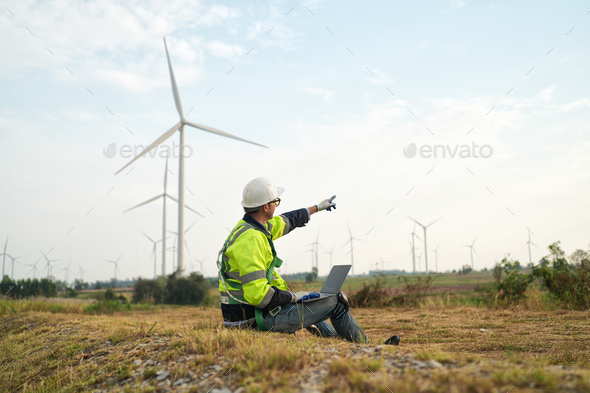 Wind turbine maintenance engineer at wind farm construction site. Wind ...
