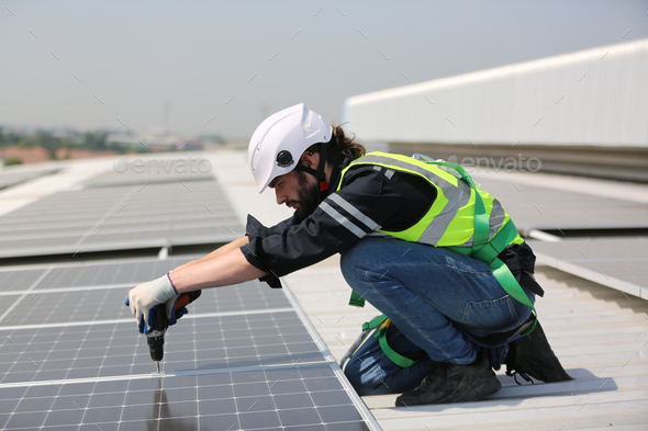 Engineer service check installation solar cell on the roof of factory ...