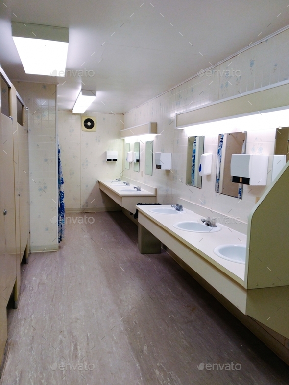 Modern public restroom with white interior and mirrors with sinks Stock ...