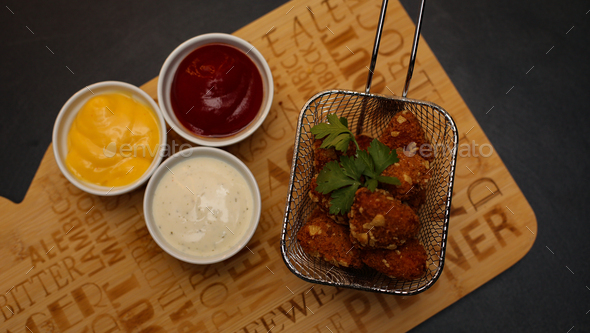 Top view of delicious crispy fried breaded chicken patties served with ...