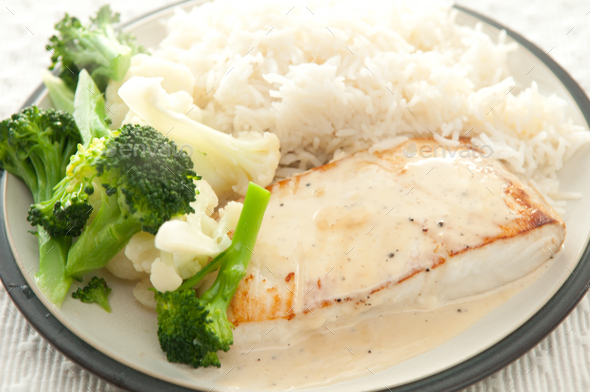 Closeup shot of chicken with white sauce, rice, and green beans Stock ...