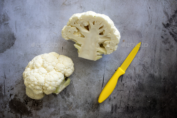 Top view of cauliflower cut in half on the table under the lights Stock ...