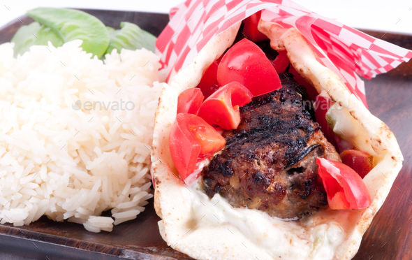 lean ground lamb gyro with rice and peas Stock Photo by wirestock ...