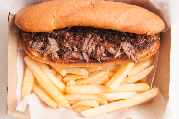 take out beef dip or french diup with fries Stock Photo by wirestock