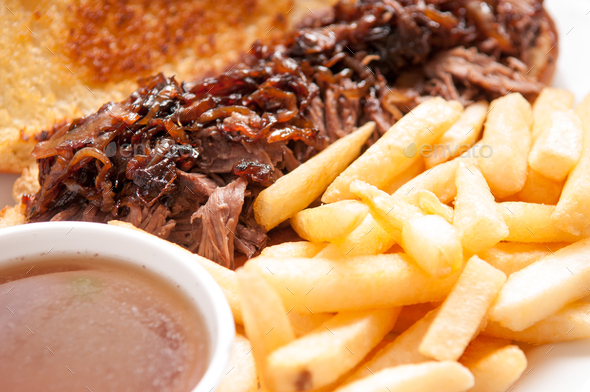 take out beef dip or french diup with fries Stock Photo by wirestock