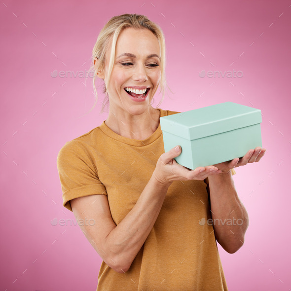 Gift, box and woman in studio with smile, pink background and package ...