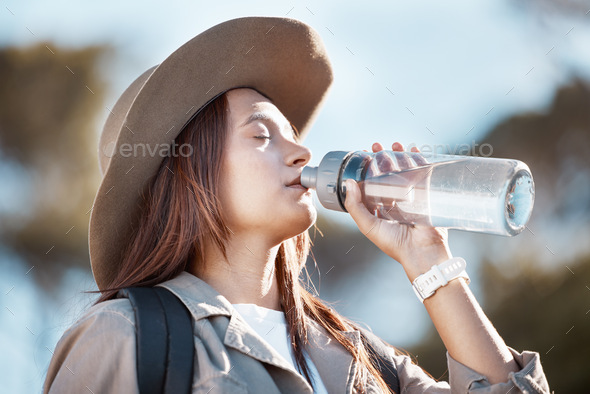 Hiking, fitness and woman drinking water for outdoor adventure, nature ...