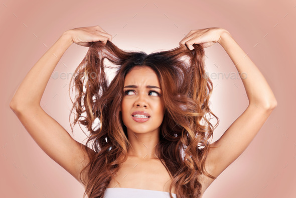Sad, beauty and hair loss of woman in studio isolated on a pink ...