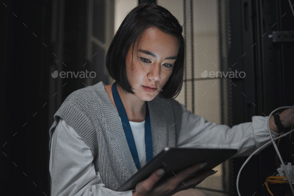 Tablet, server room and communication with a programmer asian woman at ...
