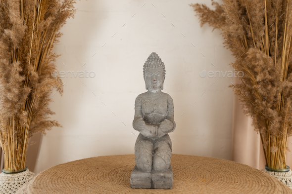 Modern minimal interior and Buddha statue near window. Home decor with ...