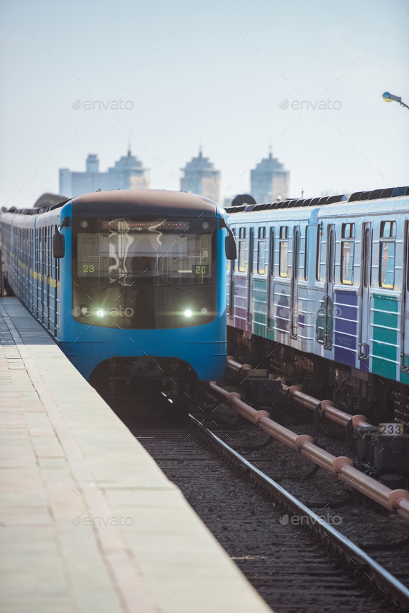 trains at outdoor subway station with buildings on background Stock ...