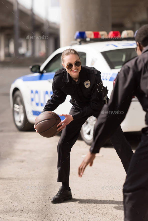 active young police officers playing basketball on street Stock Photo ...