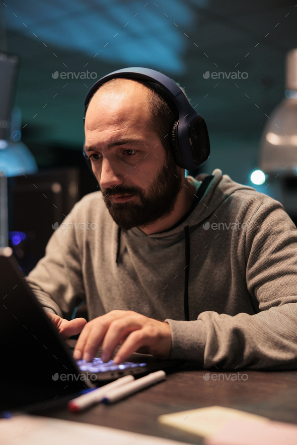 Database admin typing code and creating algorithm Stock Photo by DC_Studio