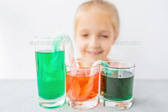 cute little girl six years old doing laboratory experiment with ...