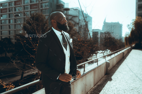A Bald Black Man in Sharp Suit and Beard Stock Photo by SkyNextphoto