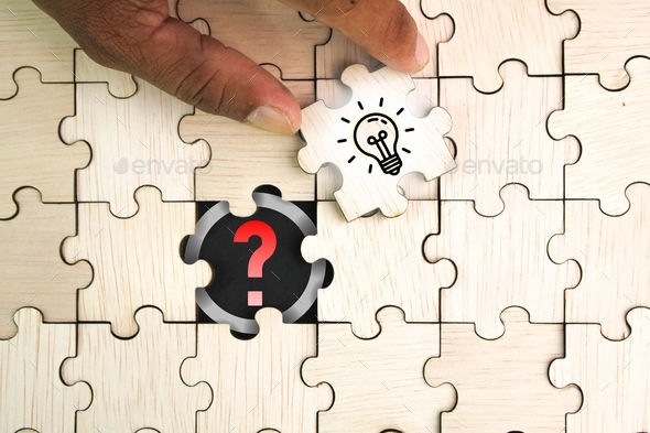 wooden puzzle with question mark icon and idea. Stock Photo by fauziEv8