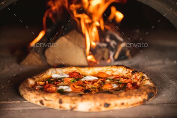 Closeup shot of a Neapolitan pizza in a wood fired pizza oven Stock ...