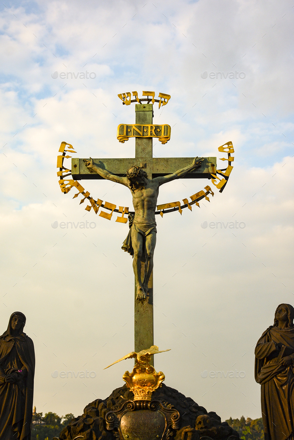 Vertical shot of the Crucifixion cross on the Charles Bridge in Prague ...