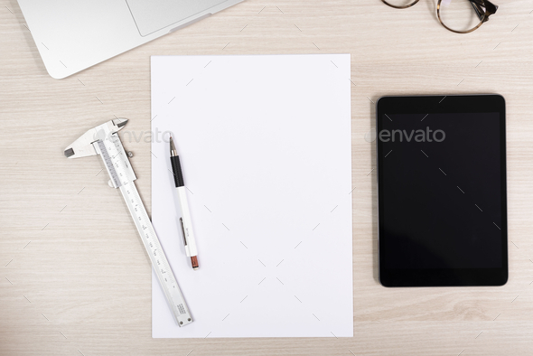 Top view of businessman workplace with papers, pen, vernier caliper ...