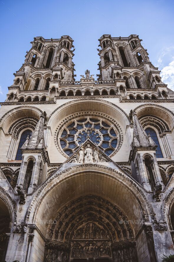 Low angle of Laon Cathedral, France under blue sky Stock Photo by wirestock