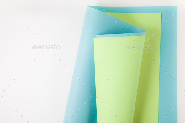 blue and green paper sheets on grey background Stock Photo by ...