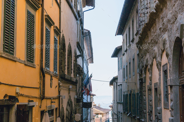 urban scene with beautiful buildings and narrow street, Tuscany, Italy ...