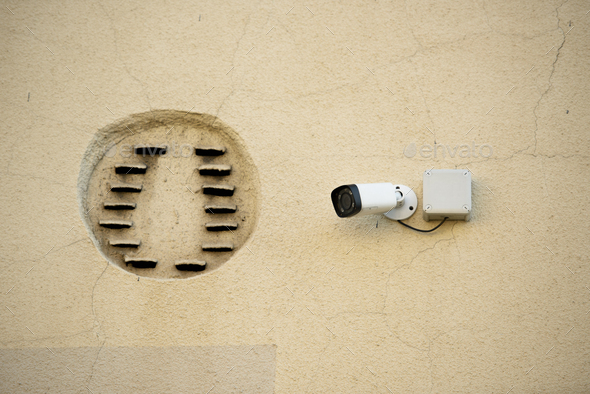 close up view of security camera on cracked building facade Stock Photo ...